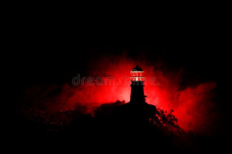 Lighthouse with Light Beam at Night with Fog. Old Lighthouse Standing ...