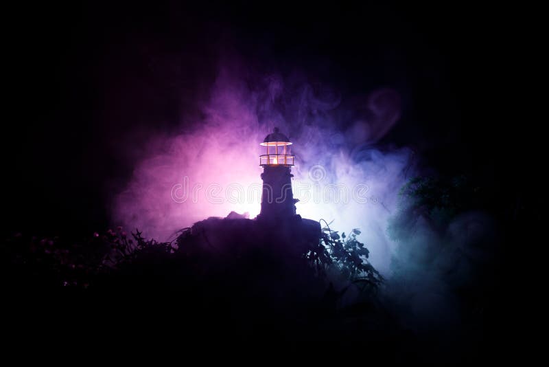 Lighthouse with Light Beam at Night with Fog. Old Lighthouse Standing ...