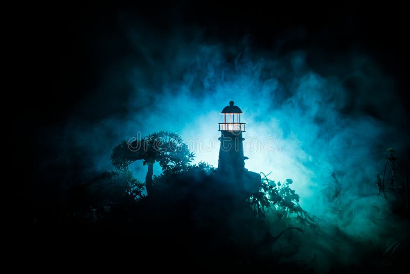 Lighthouse with Light Beam at Night with Fog. Old Lighthouse Standing ...