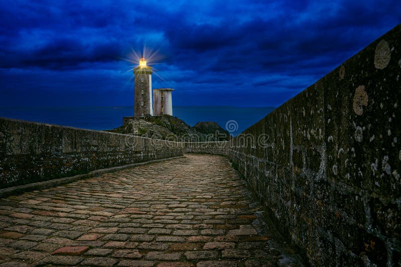 Lighthouse with Light on during the Blue Hour Stock Image - Image of ...