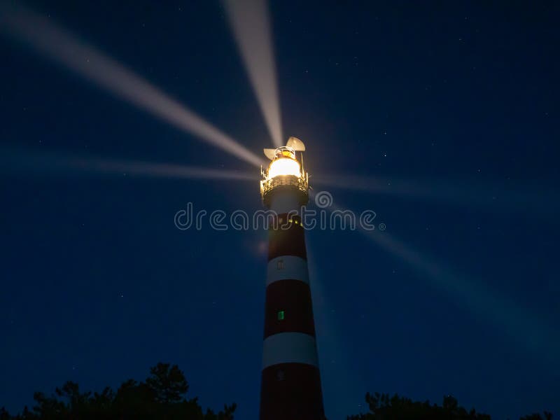 Lighthouse with Light Rays during Night on the Island of Ameland Hollum ...