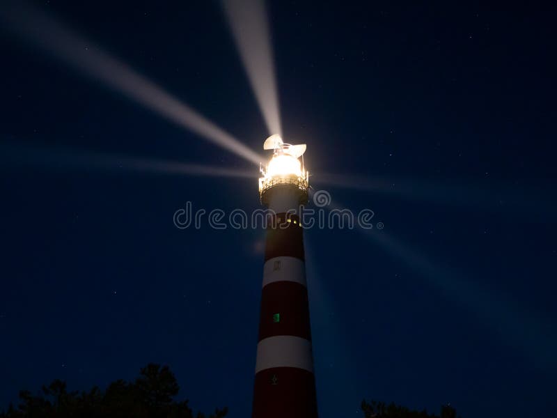 Lighthouse with Light Rays during Night on the Island of Ameland Hollum ...