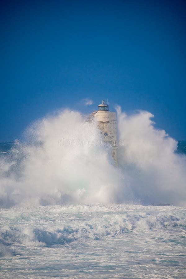 The Lighthouse of the Mangiabarche Shrouded by the Waves of a Mistral ...