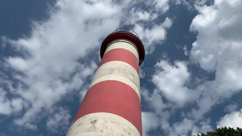 Lighthouse on a Moving Cloud Background. Bottom View Stock Video ...