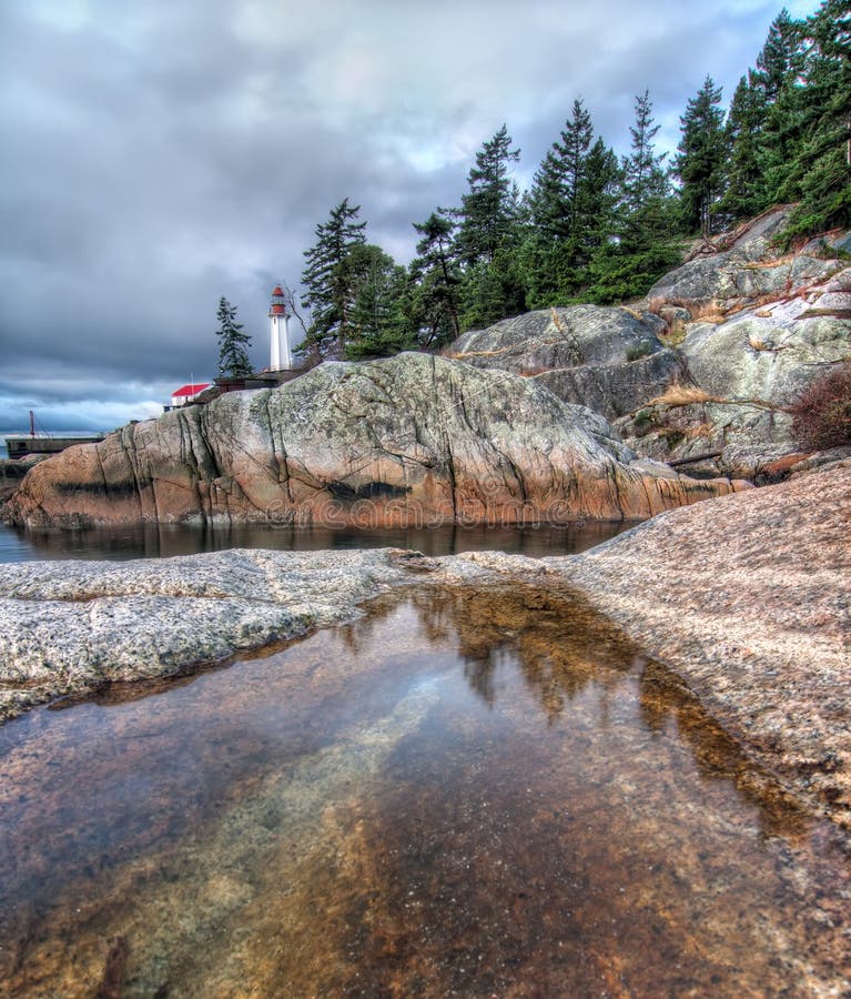 Lighthouse Next To Trees on Cliff Stock Photo - Image of shipping ...