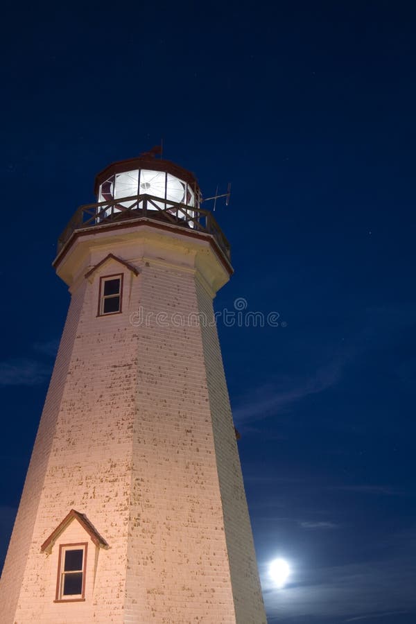 Lighthouse at Night stock photo. Image of moon, landmark - 17894748