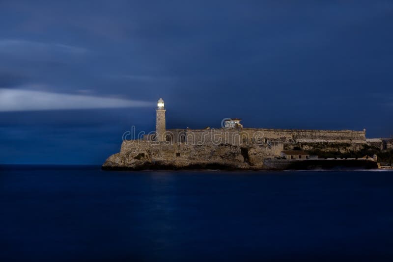 Lighthouse in night stock photo. Image of rocks, lights - 23000210