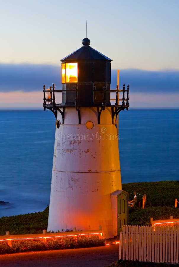 Lighthouse at night stock photo. Image of orange, historic - 4575032