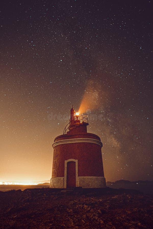 Lighthouse during the Night with the Sky with a Lot of Stars Stock ...