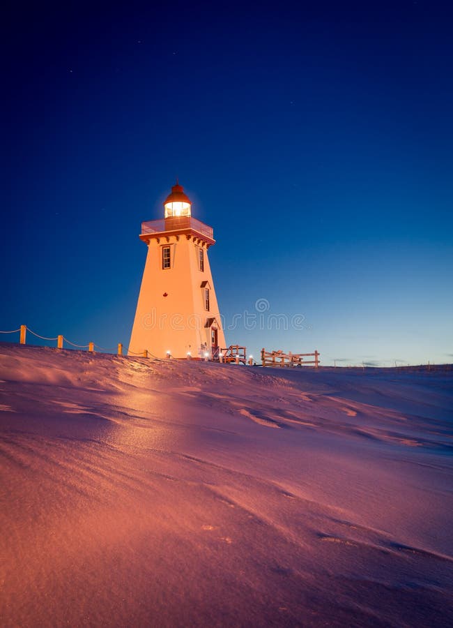 Lighthouse at Night in Winter Stock Photo - Image of island, twilight ...