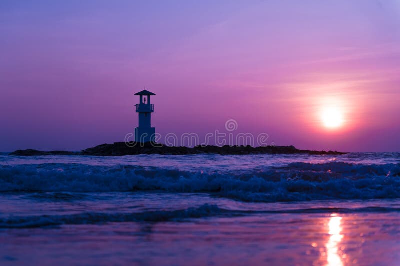 A Lighthouse in the Ocean during a Beautiful Sunset Stock Image - Image ...