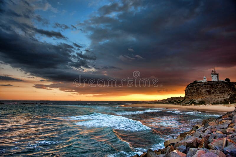 Lighthouse and Ocean Sunset Stock Photo - Image of seascape, light ...