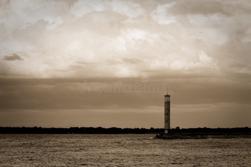 Lighthouse or Old Beacon Under Storm Clouds Stock Photo - Image of ...