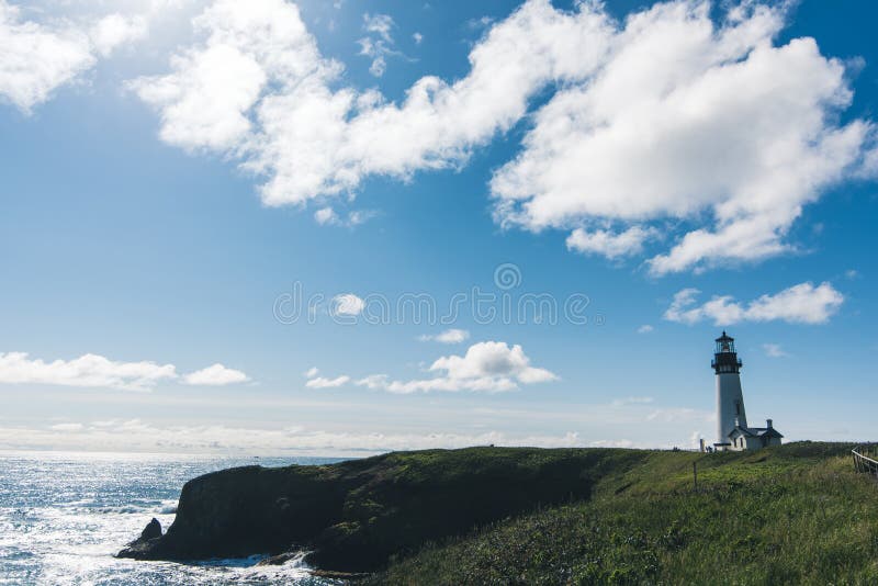 A Lighthouse Overlooking the Ocean. Stock Image - Image of cloudy ...