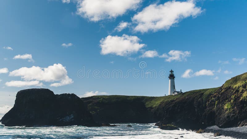 A Lighthouse Overlooking the Ocean. Stock Photo - Image of shore ...