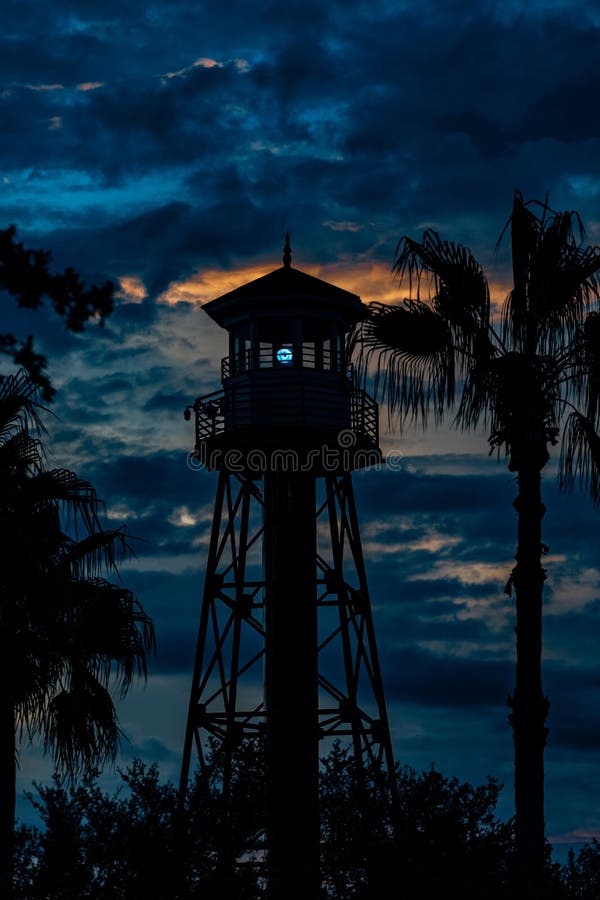 Lighthouse and Palm Trees at Dusk Stock Image - Image of tree, skyin ... Lighthouse and Palm Trees at Dusk Stock Image - Image of tree, skyin ...