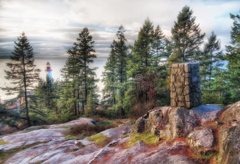 Lighthouse Peaking through Trees Stock Photo - Image of historic ...