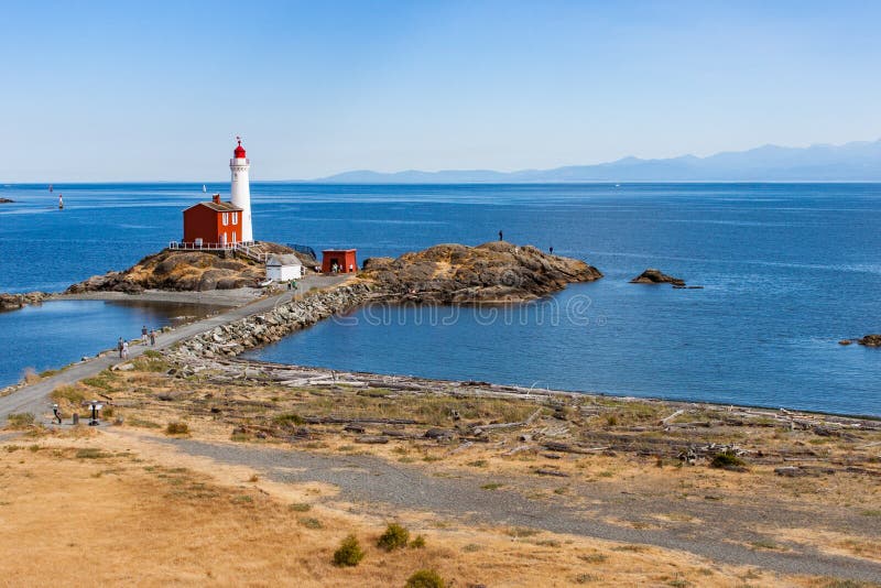 Lighthouse on Peninsula by Ocean Stock Image - Image of structure ...