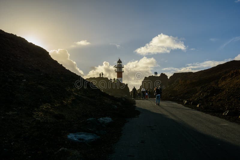 Lighthouse in the Sunset. Lighthouse and People Stock Image - Image of ...