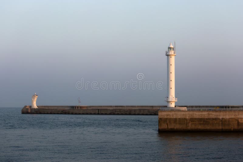 Lighthouses in the Evening Light on the Pier Stock Image - Image of ...