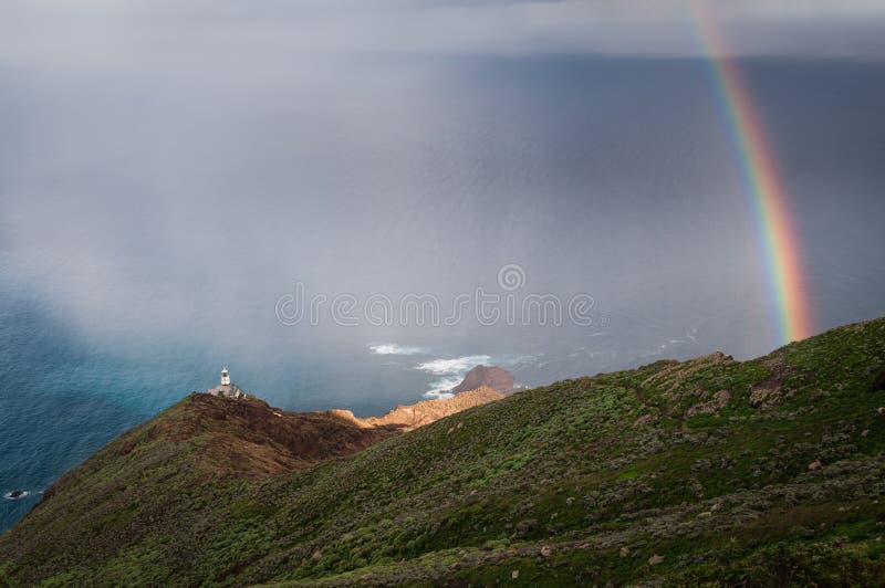 Lighthouse and rainbow stock photo. Image of colorful - 33457084