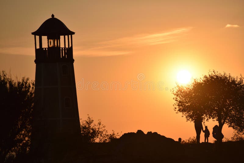 Lighthouse in the Rays of Sunset. Stock Photo - Image of shadows, sight ...