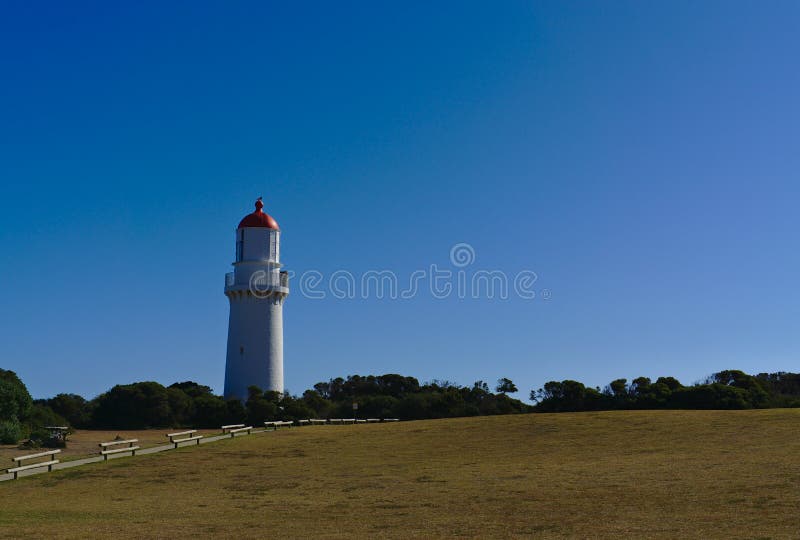 Lighthouse with red roof stock photo. Image of light - 141141798