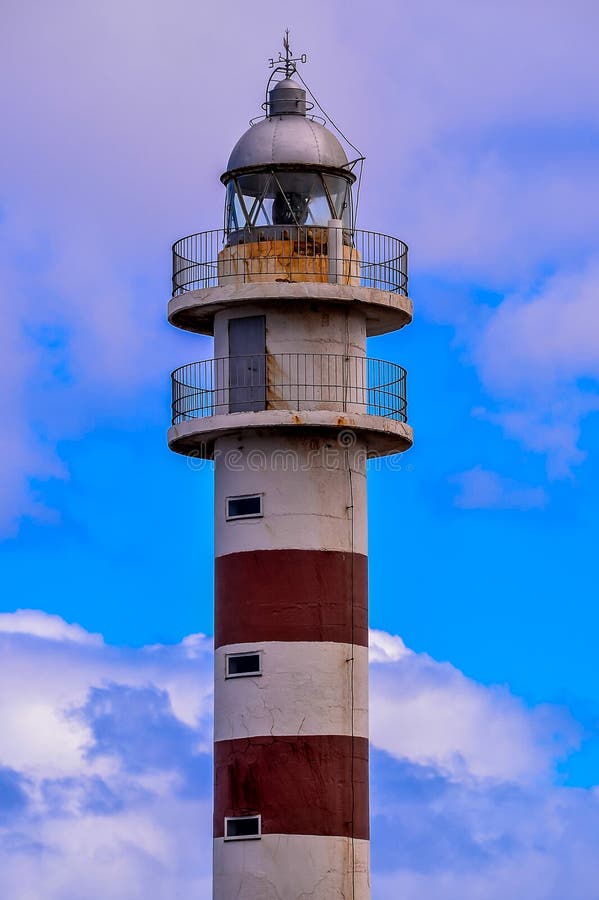 A Lighthouse with a Red and White Striped Tower Stock Image - Image of ...
