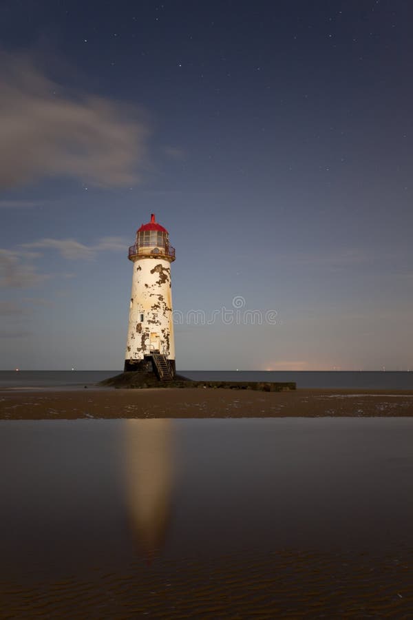 Lighthouse Reflection at Night Stock Photo - Image of derelict, beach ...