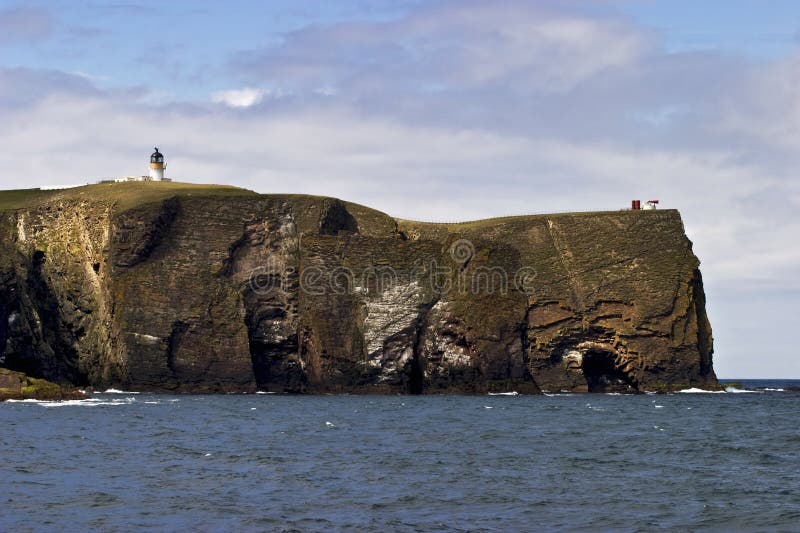 Lighthouse on the rock stock photo. Image of landmark - 2896626