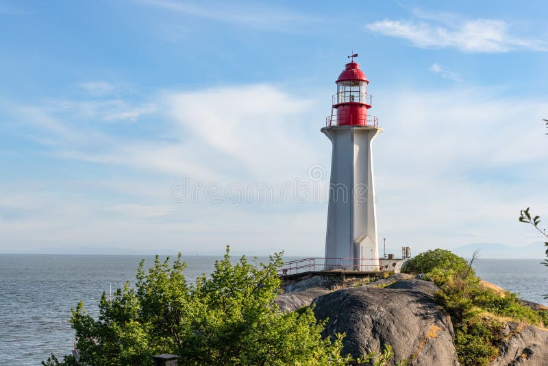 White Lighthouse on the Isalnd in the Ocean Stock Image - Image of ...