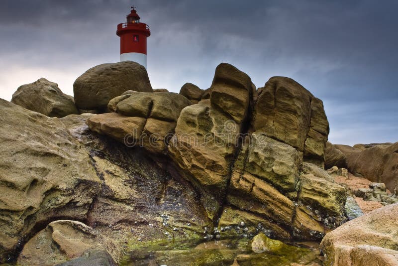 Lighthouse on Rocks stock photo. Image of safety, coast - 9410918