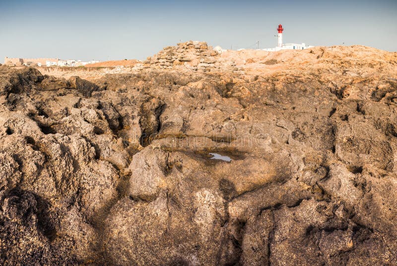 Lighthouse on the rocks stock photo. Image of remote - 35215148