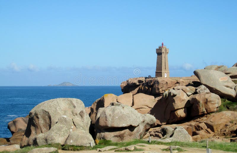 Lighthouse on the rocks stock photo. Image of landscape - 78853804