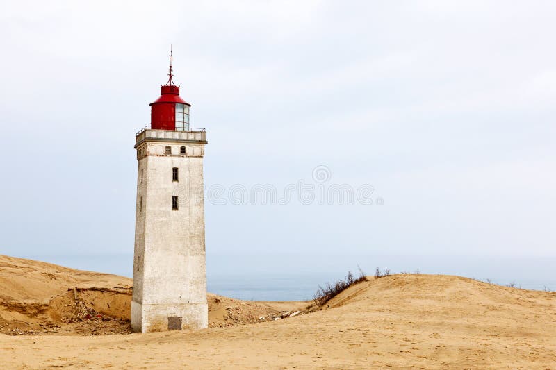 Lighthouse and sand dune stock photo. Image of land, sand - 16763906
