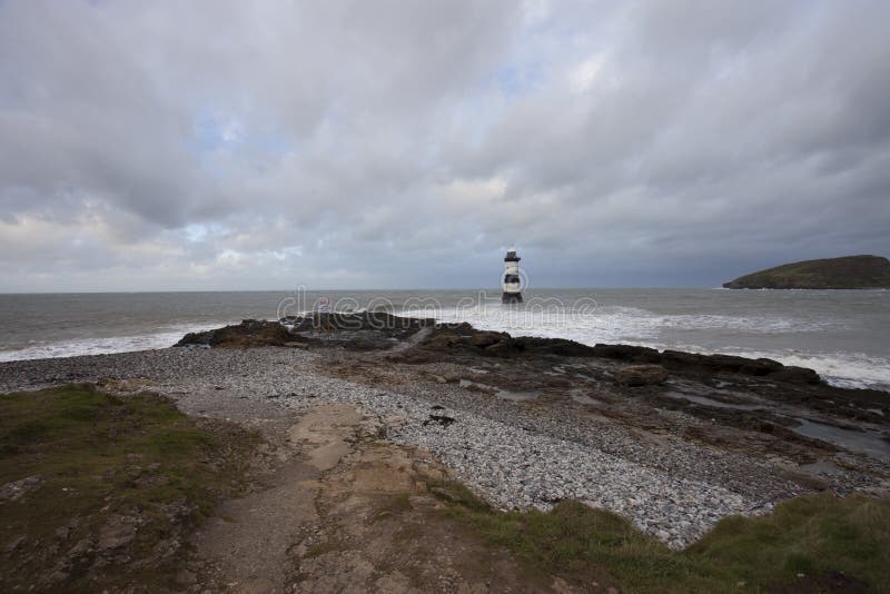 Lighthouse on shore stock image. Image of clouds, cloudy - 29731221