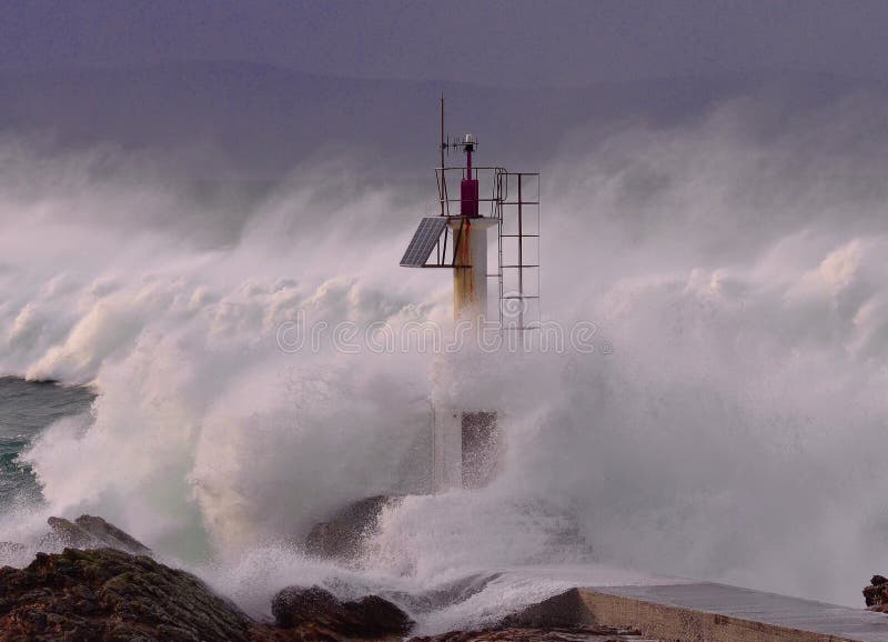 Lighthouse in the Rough Sea Stock Photo - Image of beacon, danger ...