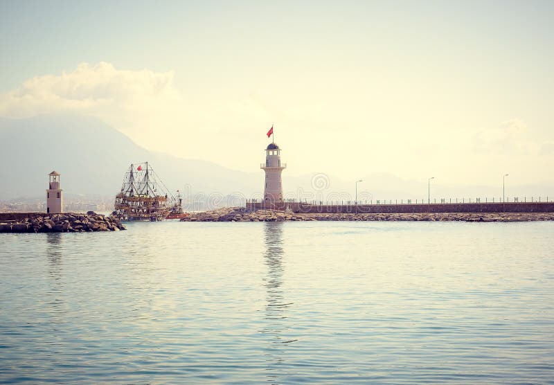 Lighthouse and Sail Ships in the Mediterranean Sea Stock Photo - Image ...