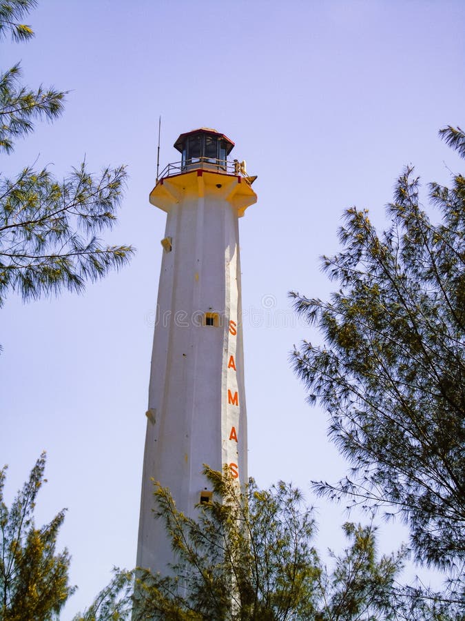 Lighthouse at the Samas& X27; Beach Behind the Forest at Noon Stock ...