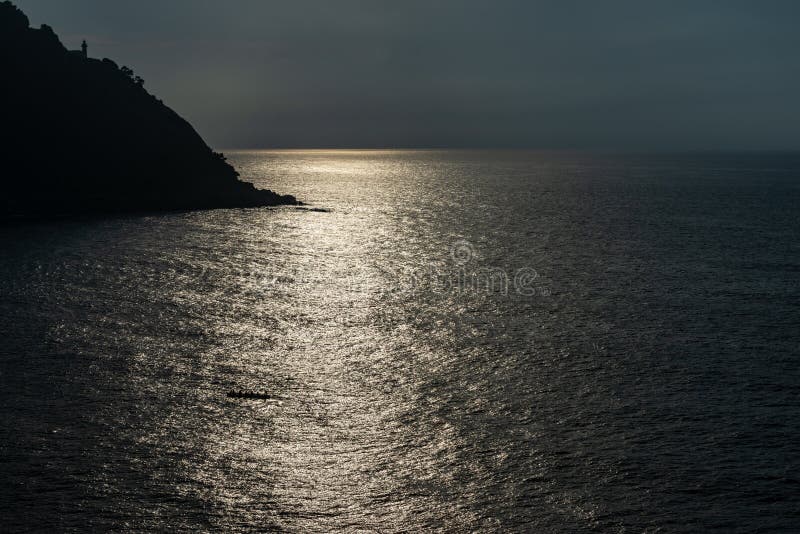 Lighthouse of San Sebastian at Sunset Backlight Stock Photo - Image of ...