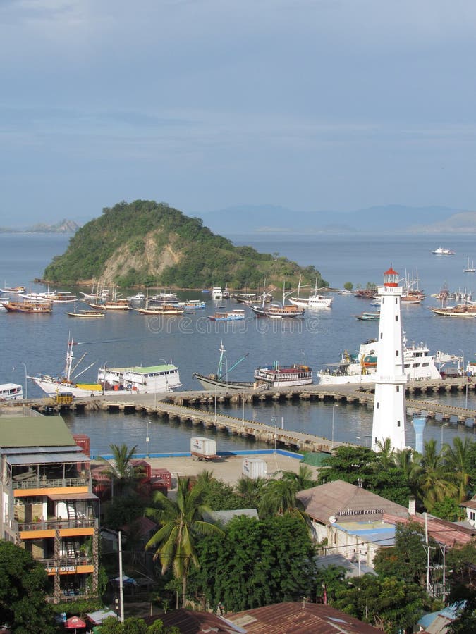Old Lighthouse at harbor editorial stock image. Image of shore - 269811849