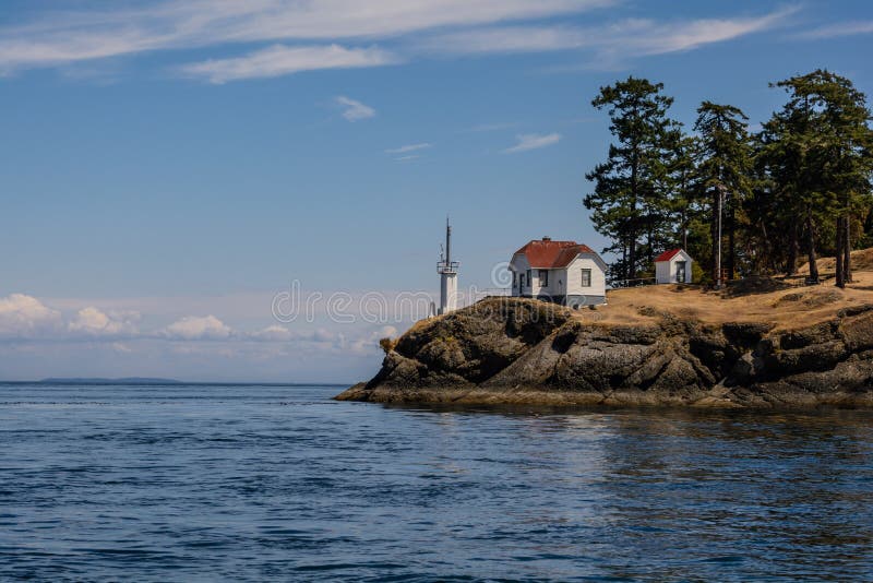 A lighthouse on the shore. stock image. Image of plants - 91519991
