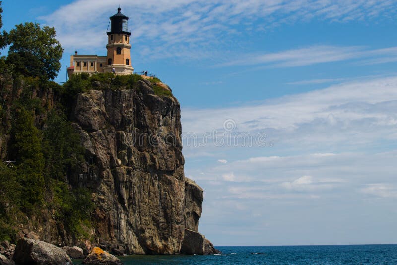 A Lighthouse on the Side of a Cliff with a Lake View. Stock Image ...