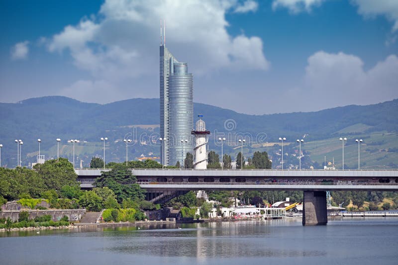 Lighthouse and Skyscraper on Danube River Editorial Image - Image of ...