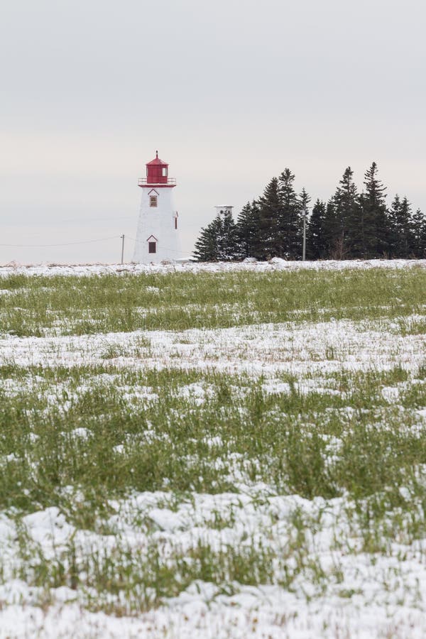 Lighthouse in Snow Field stock photo. Image of light - 51217600