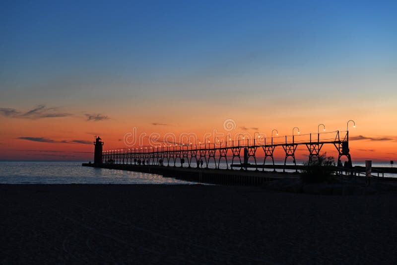 Lighthouse in South Haven at Sunset Stock Photo - Image of scenic ...