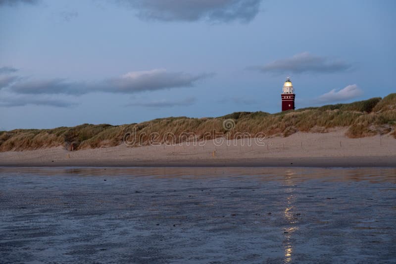 Lighthouse Standing on the Dutch Coast with a Dramatic. and Colorful ...