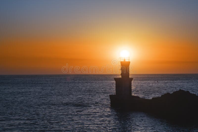 Lighthouse and Sun at Sunset at the Exit of the Port of Pasaia, Euskadi ...