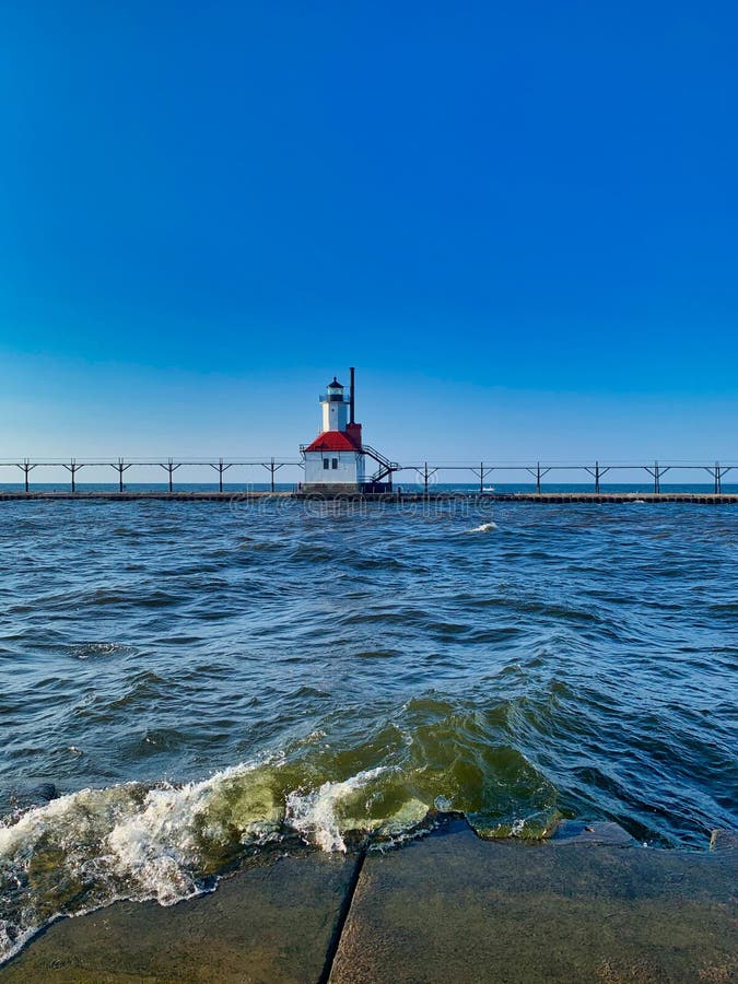Lighthouse on a Sunny Day, Water Splashing on Pier Stock Image - Image ...