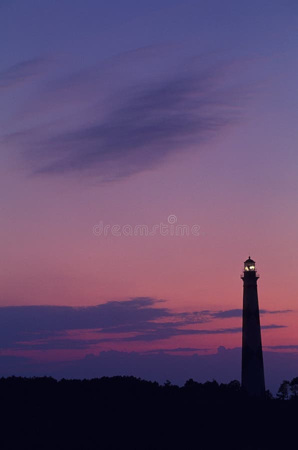 Lighthouse and Sunset stock photo. Image of clouds, warning - 28999590